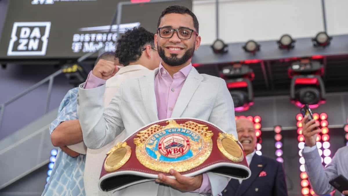 Oscar Collazo proudly shows off his WBO minimumweight title