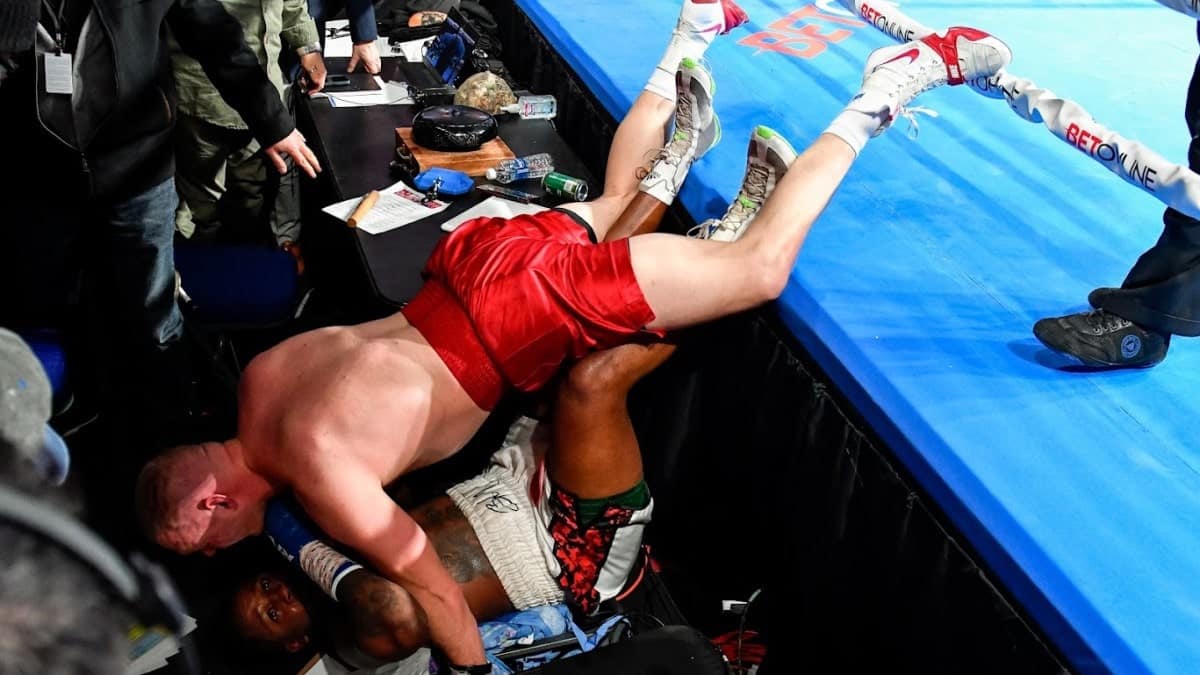 Ex-NCAA lineman lays out cameraman, tackles opponent in DQ